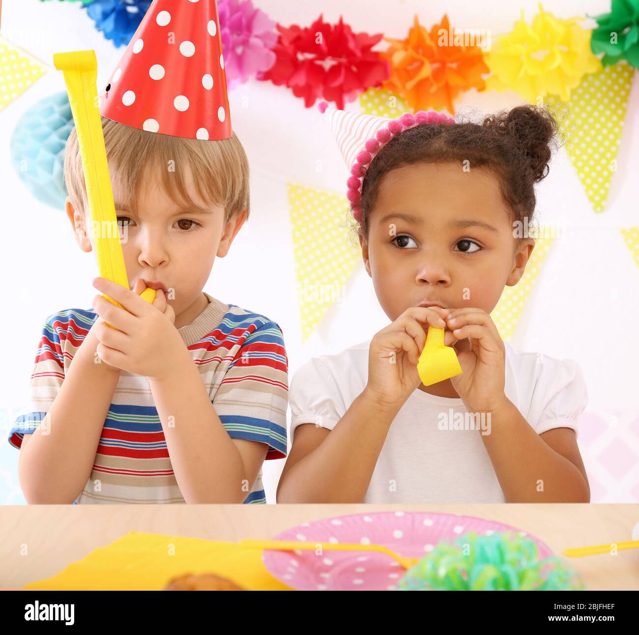 Cute little children celebrating birthday at party Stock Photo - Alamy