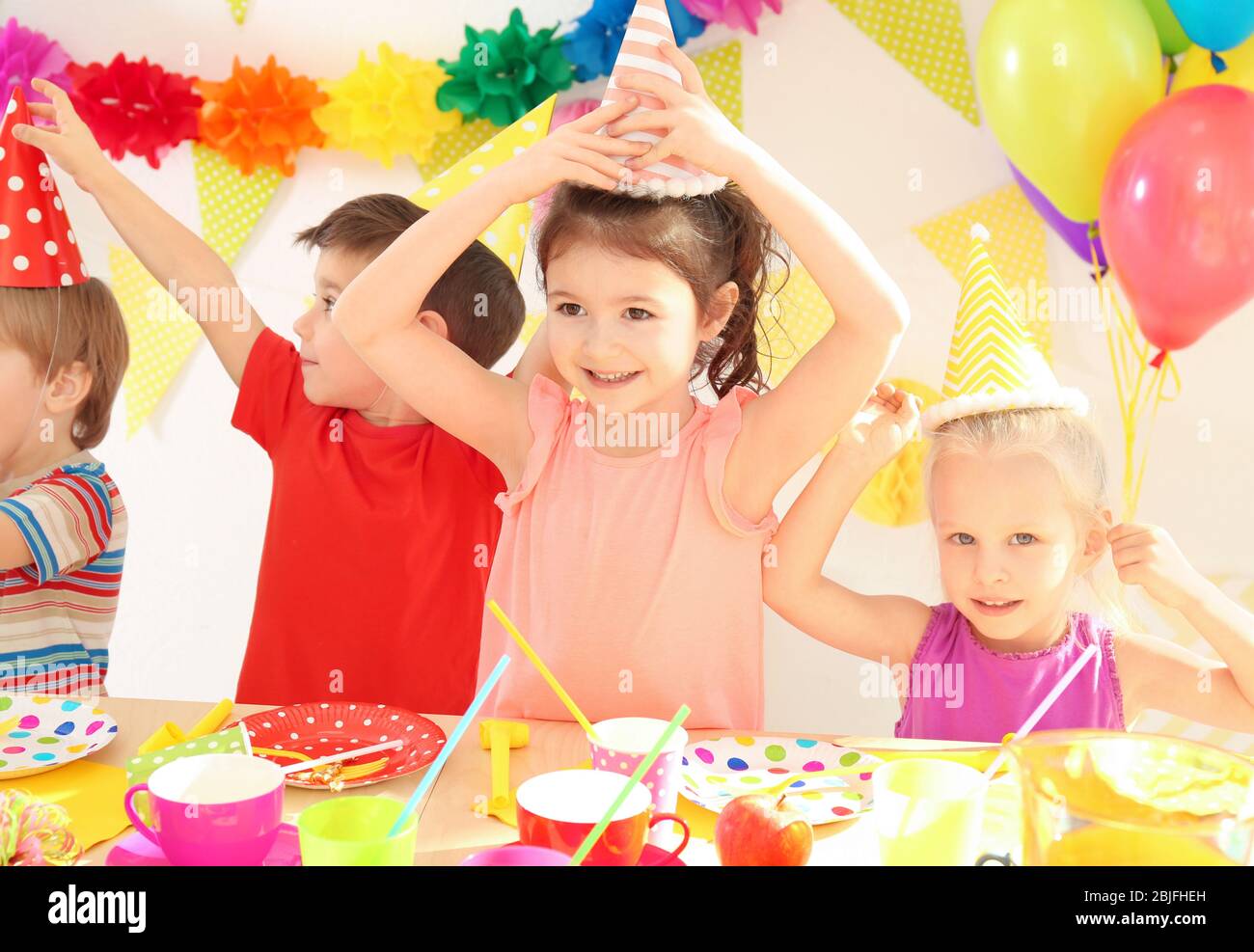 Cute little children celebrating birthday at party Stock Photo - Alamy
