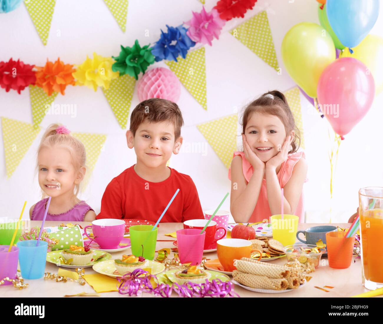 Cute little children celebrating birthday at party Stock Photo - Alamy