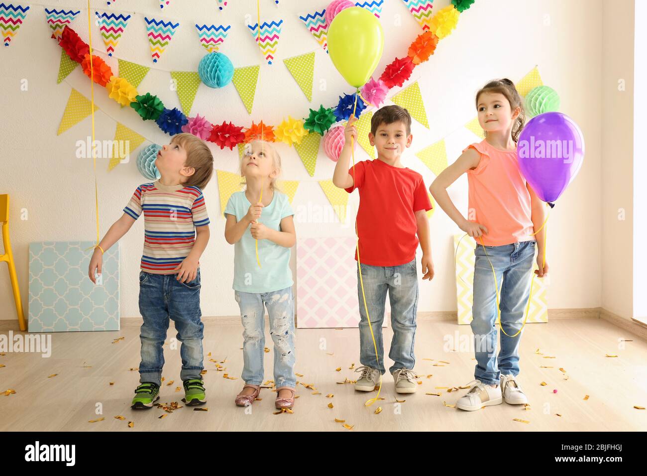Cute little children celebrating birthday at party Stock Photo - Alamy