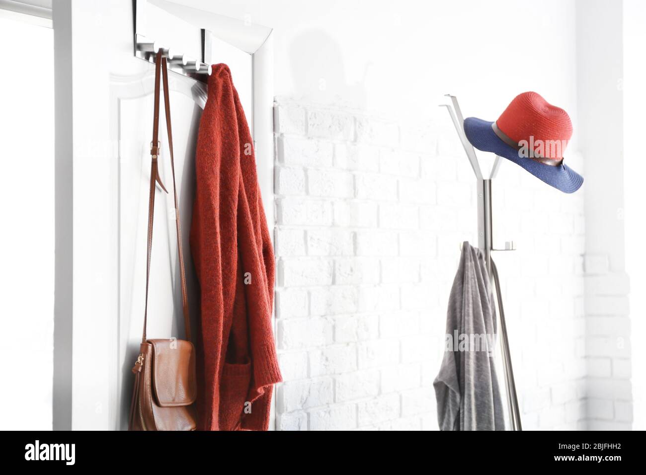 Clothes hanging entrance door hi-res stock photography and images - Alamy