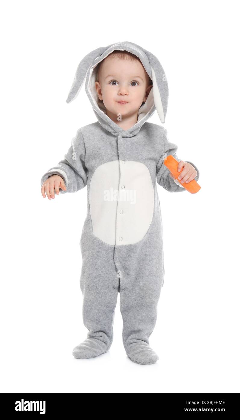 Cute little baby in bunny costume with carrot on white background Stock ...