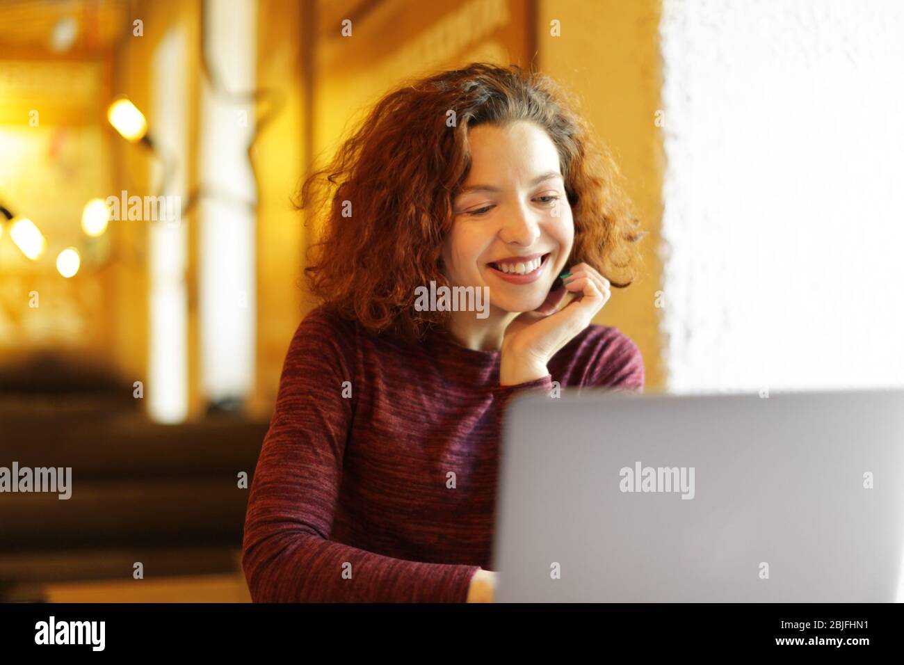 Beautiful girl with laptop in cafe Stock Photo - Alamy