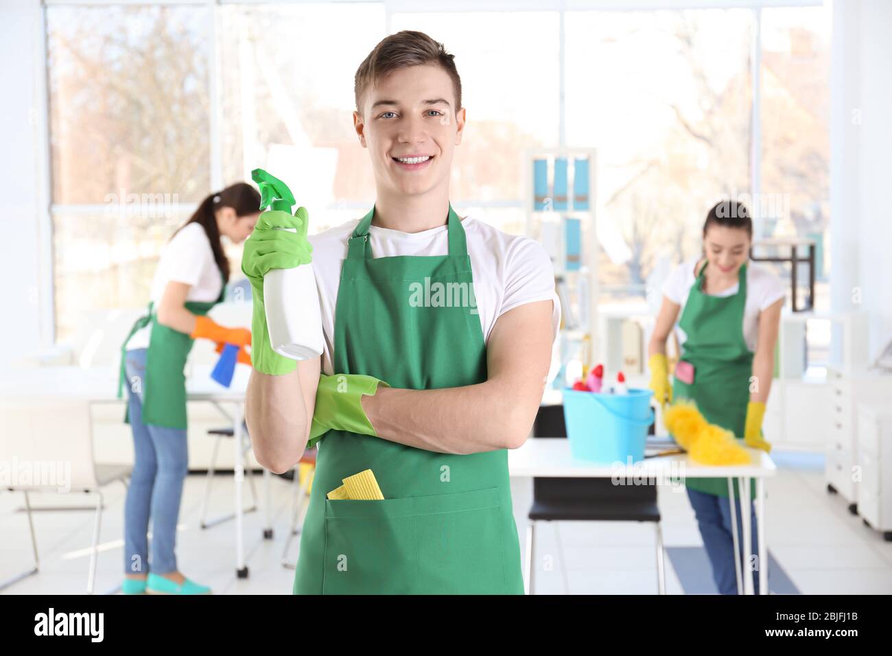 Male cleaner in uniform holding hi-res stock photography and images - Alamy