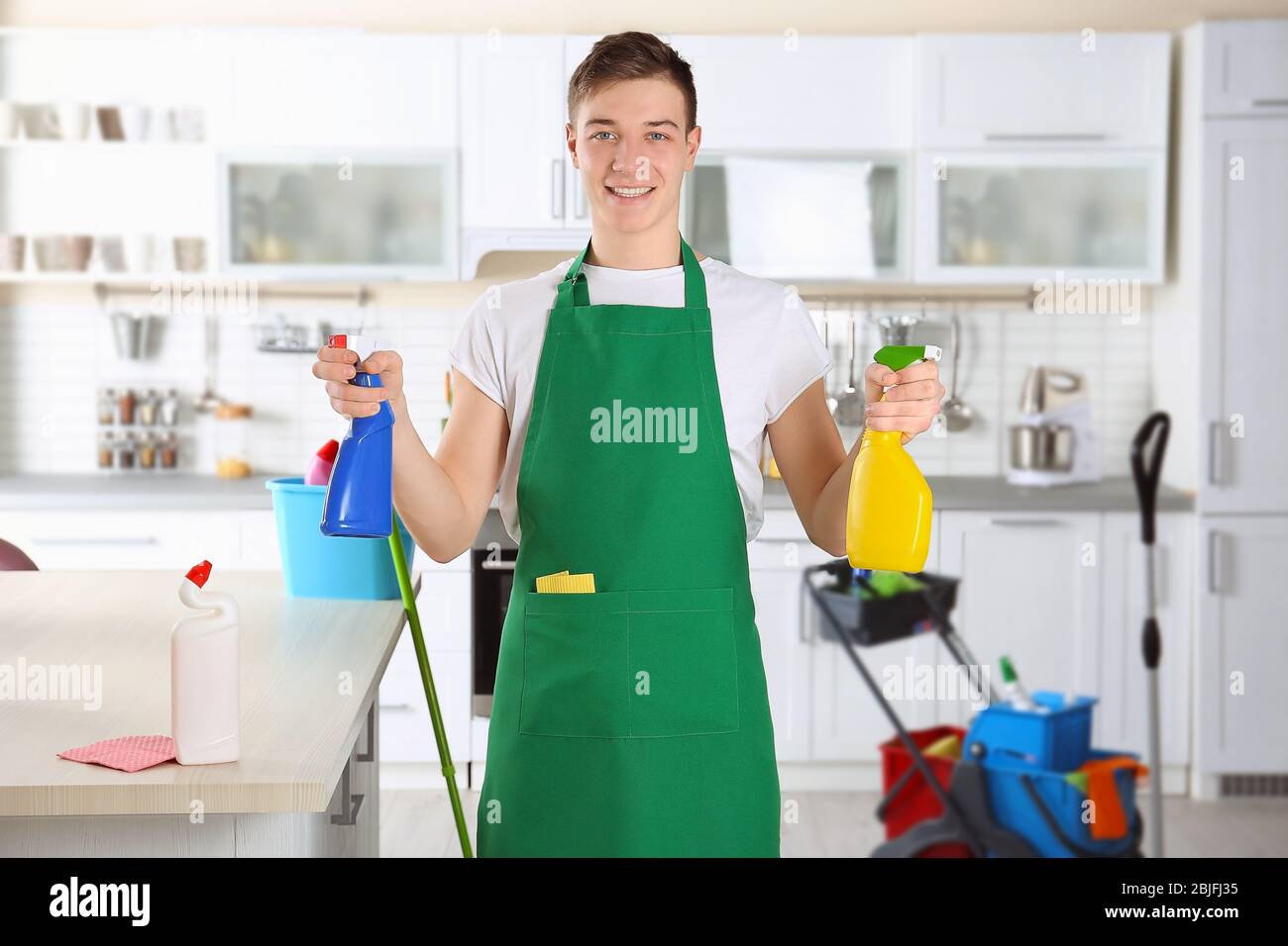 Male cleaner in uniform holding hi-res stock photography and images - Alamy