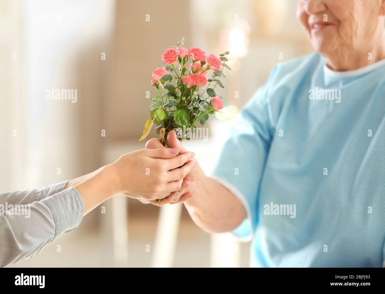 Hands Giving Flowers High Resolution Stock Photography and Images - Alamy