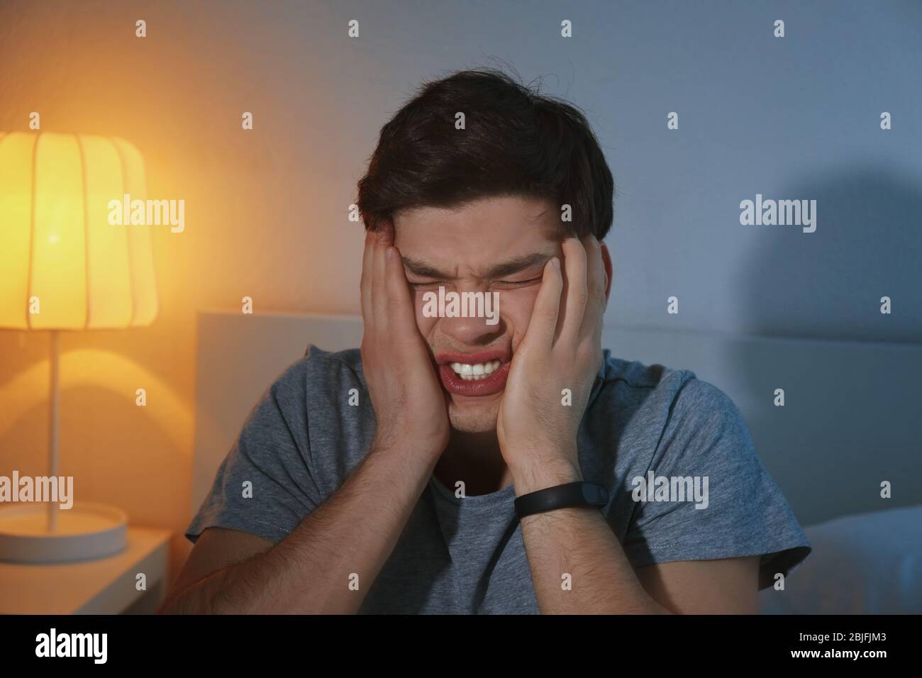 Young scared man after nightmare at home Stock Photo - Alamy