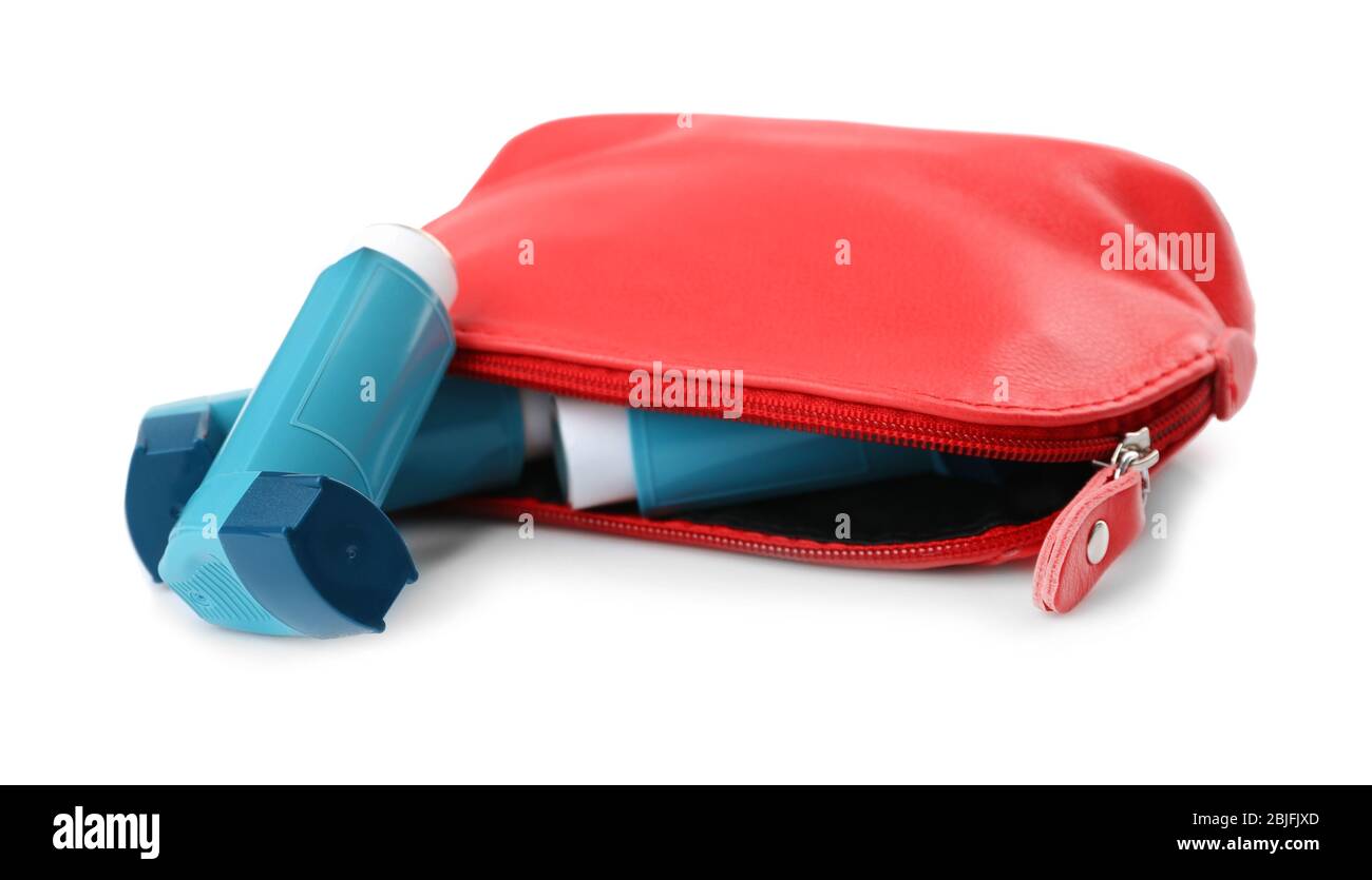 Cosmetic bag with asthma inhalers on white background Stock Photo - Alamy