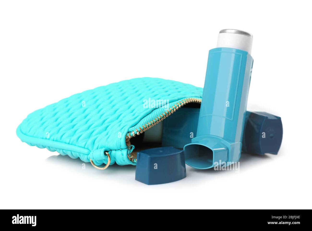 Cosmetic bag with asthma inhalers on white background Stock Photo - Alamy