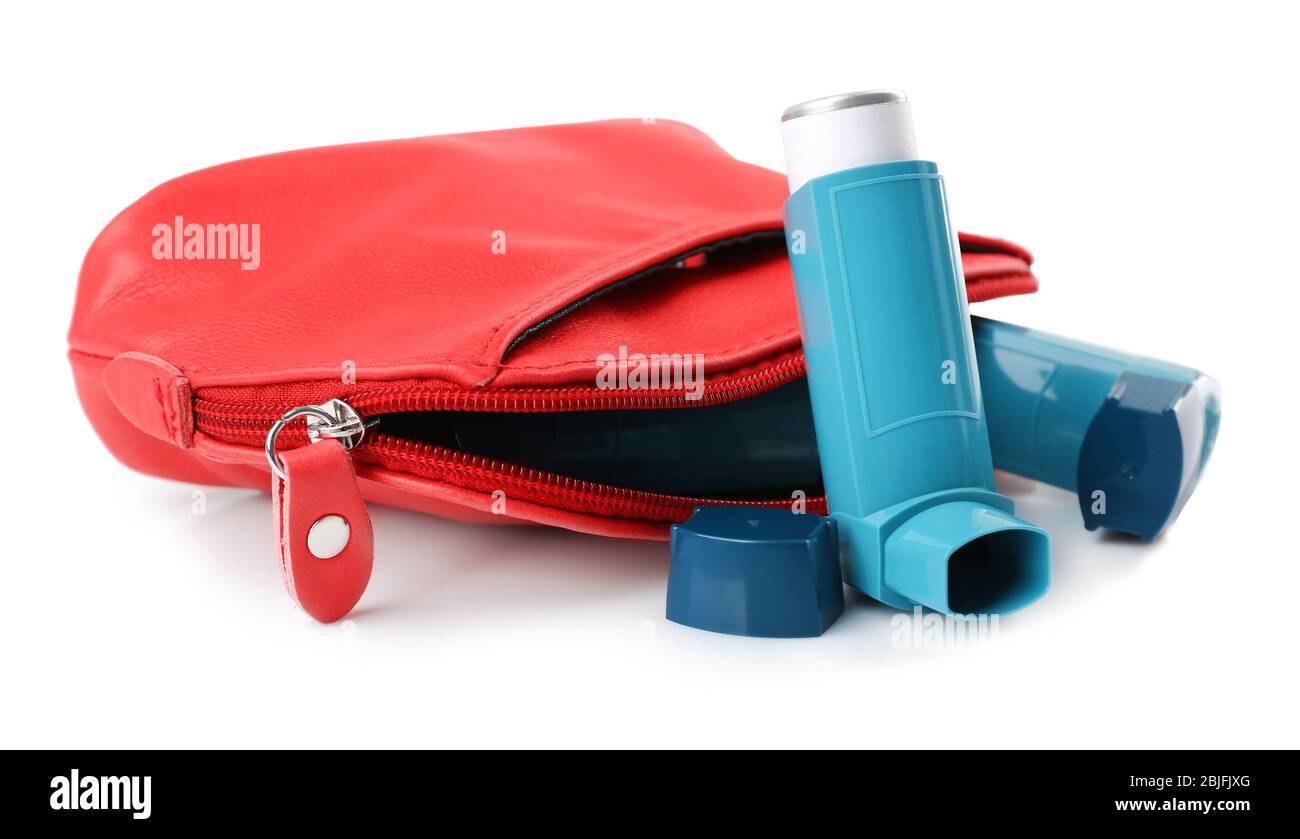 Cosmetic bag with asthma inhalers on white background Stock Photo - Alamy