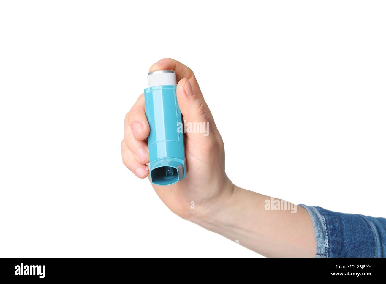Female hand holding asthma inhaler on white background Stock Photo - Alamy