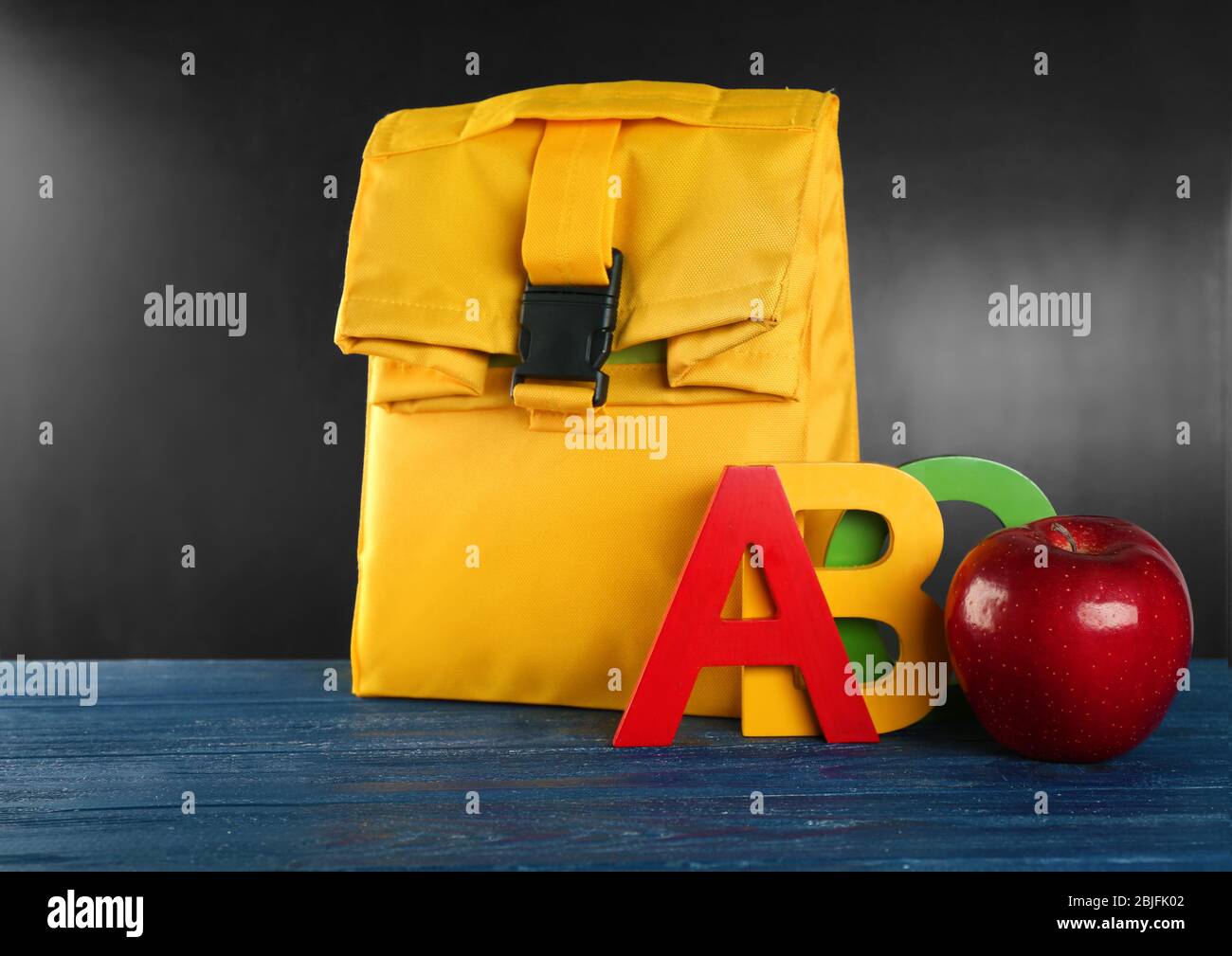 Modern lunch bag with appetizing red apple and colorful ABC letters on ...