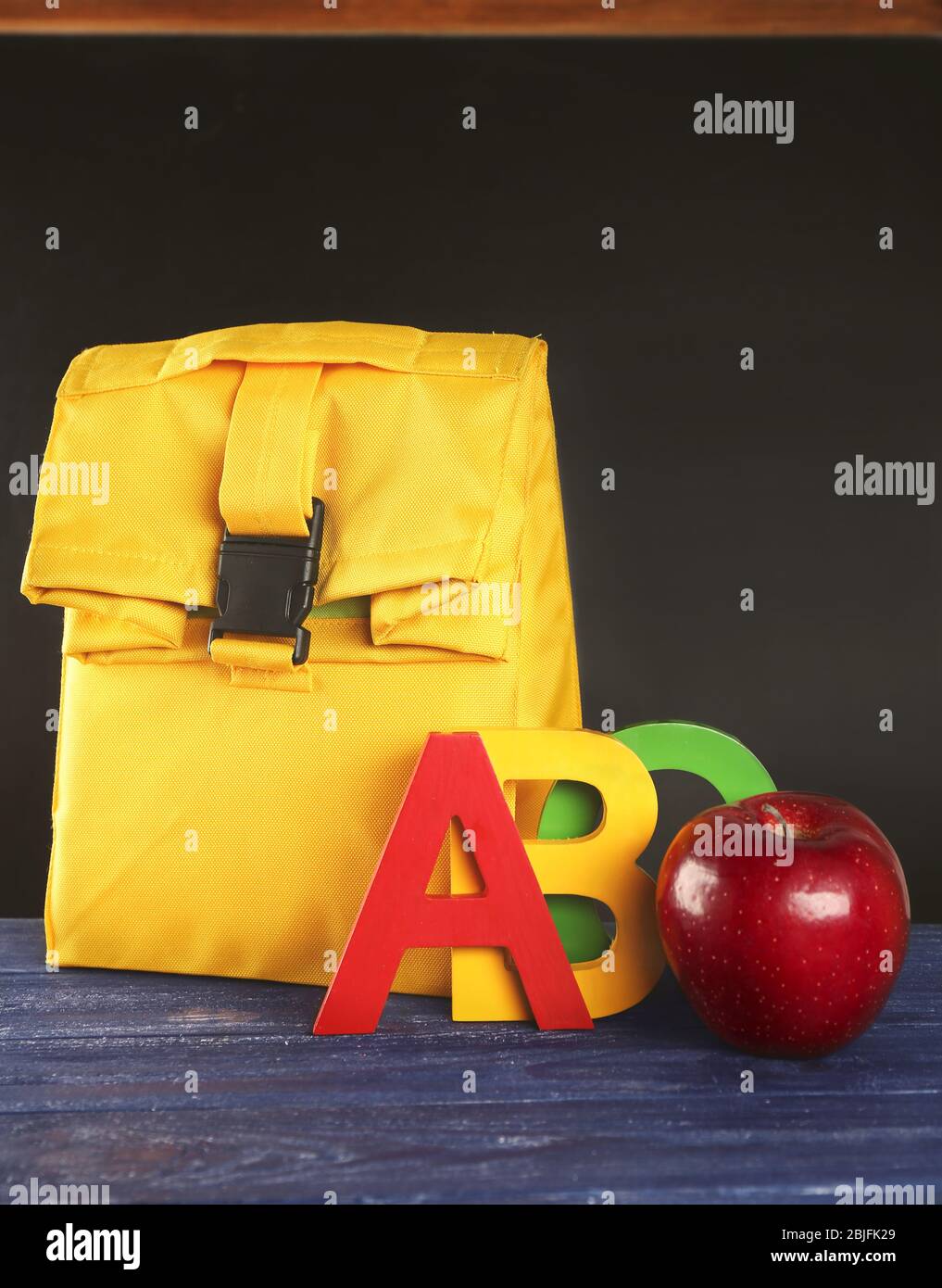 Modern lunch bag with appetizing red apple and colorful ABC letters on ...