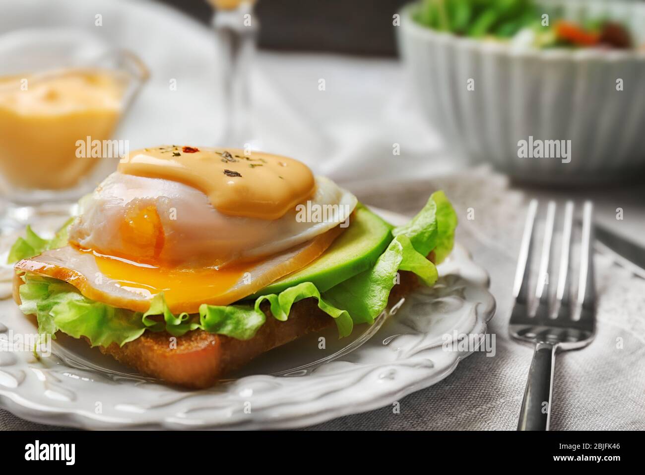 Tasty egg Benedict on plate, closeup Stock Photo - Alamy