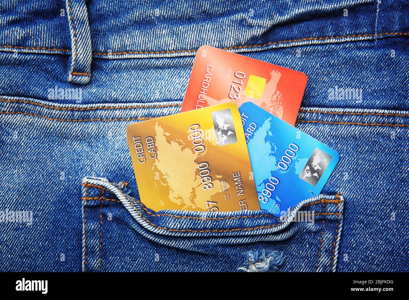 Credit cards in pocket of jeans, closeup Stock Photo - Alamy