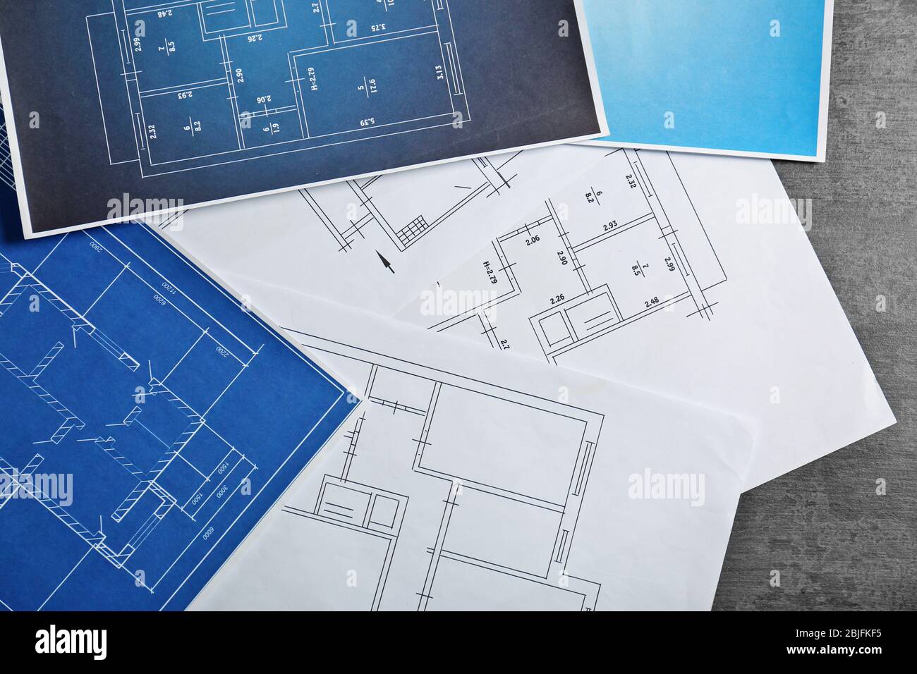 Different blueprints on table Stock Photo - Alamy