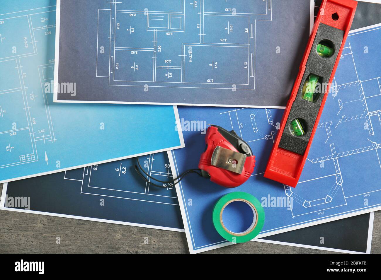 Blueprints and engineer supplies on table Stock Photo - Alamy