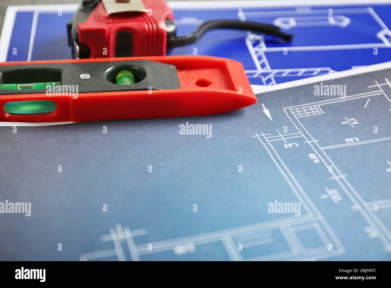 Blueprints and engineer supplies on table Stock Photo - Alamy