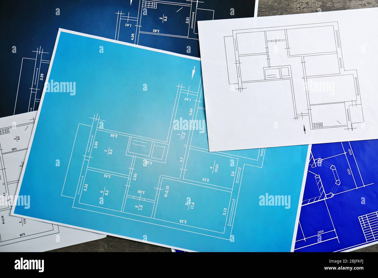 Different blueprints on table Stock Photo - Alamy