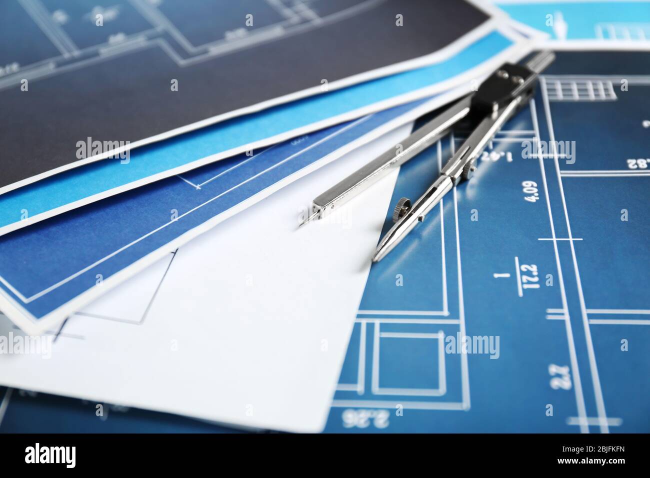 Engineering blueprints with compass, closeup Stock Photo - Alamy