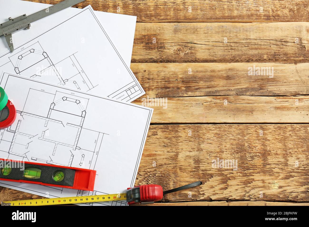 Blueprints and engineer supplies on table Stock Photo - Alamy