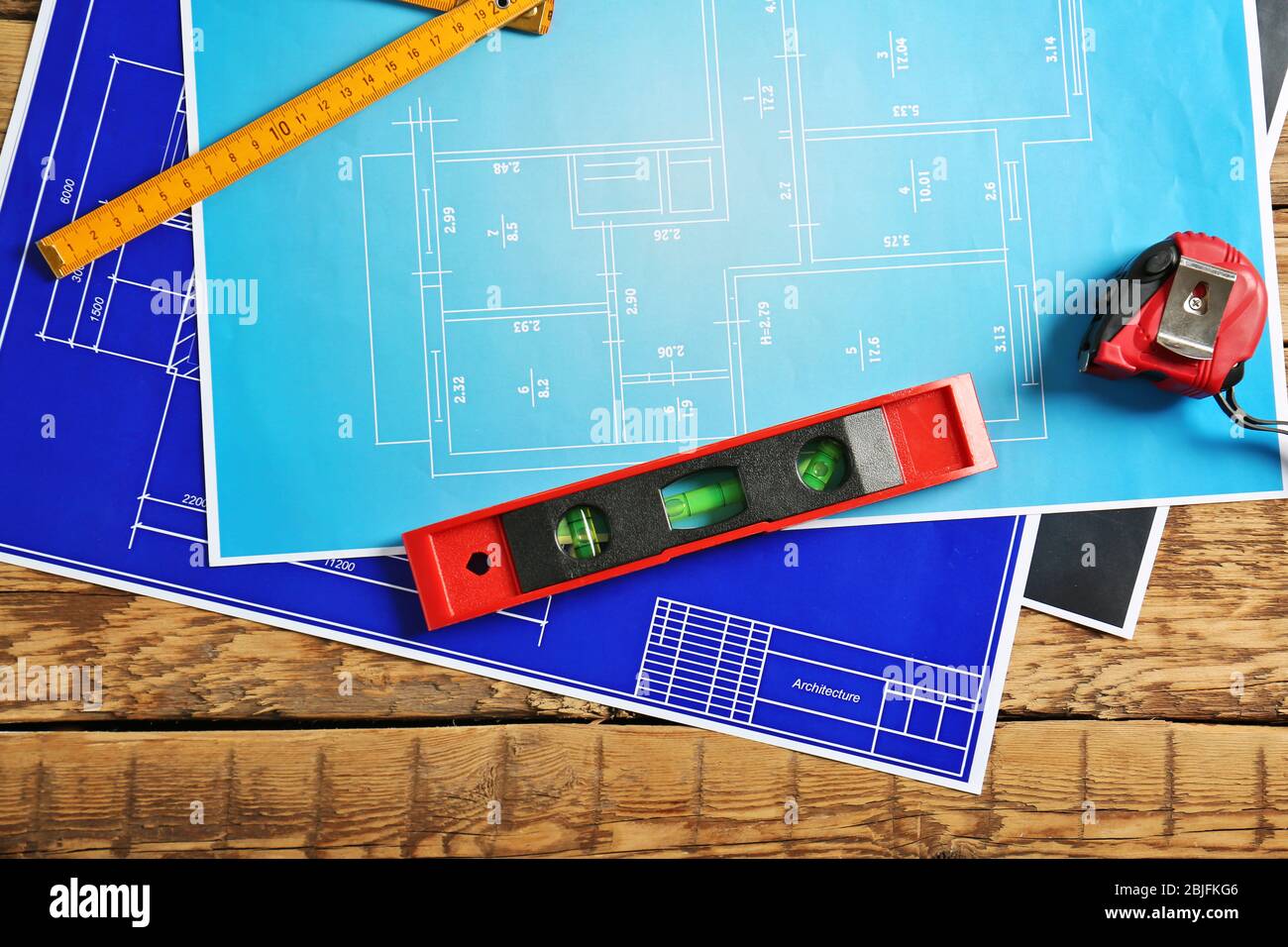 Blueprints and engineer supplies on table Stock Photo - Alamy