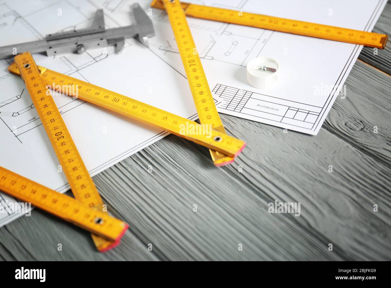 Blueprints and engineer supplies on table Stock Photo - Alamy