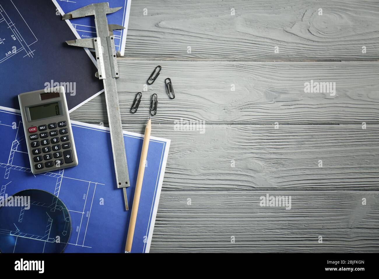 Blueprints and engineer supplies on table Stock Photo - Alamy