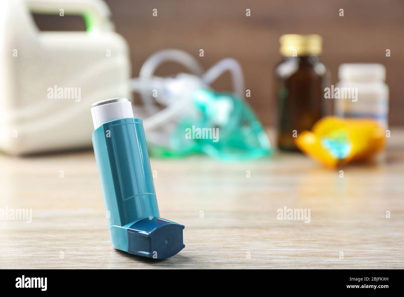 Asthma inhaler, nebuliser and medicines on wooden table Stock Photo - Alamy