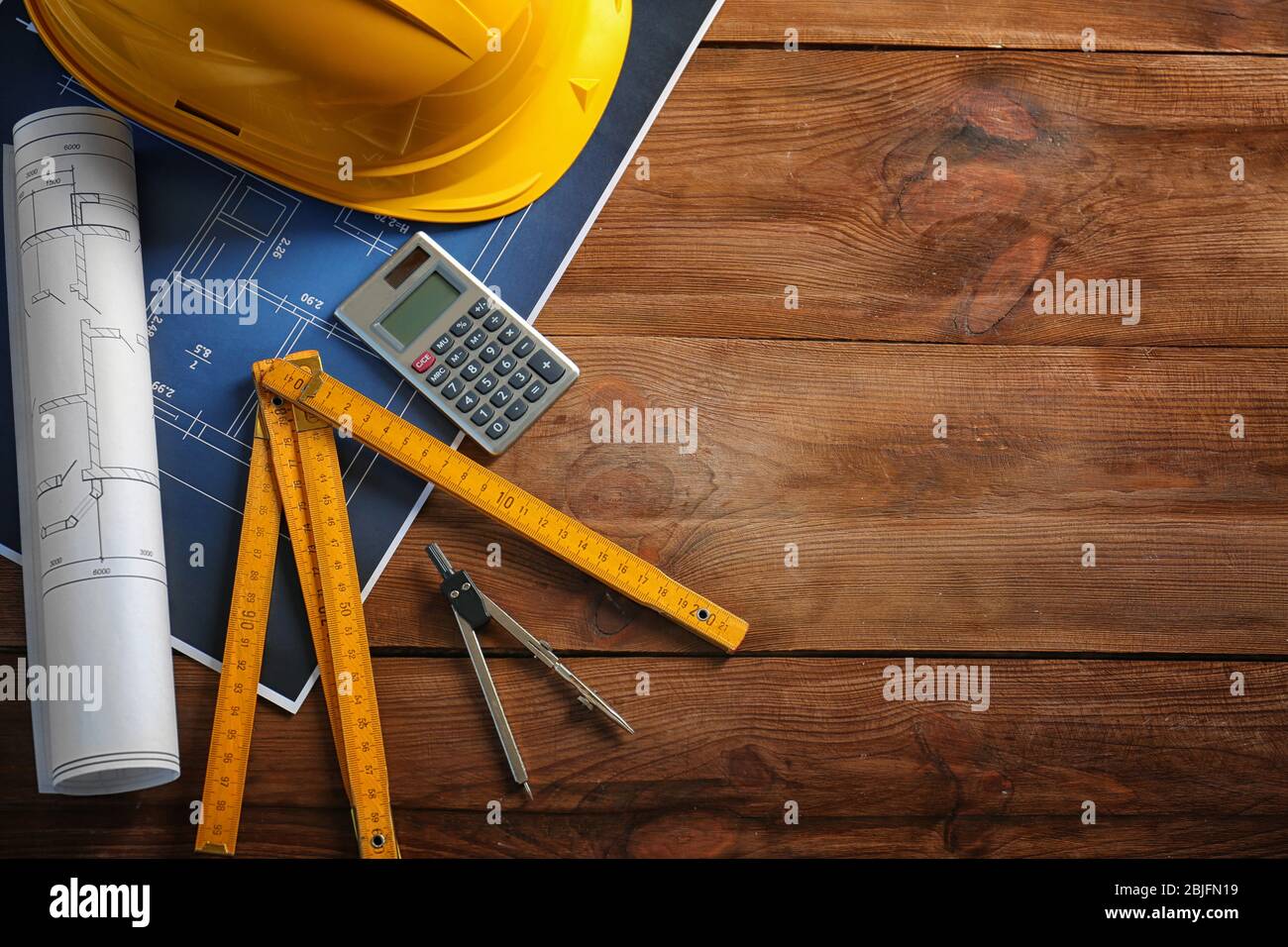 Blueprints and engineer equipment on table Stock Photo - Alamy