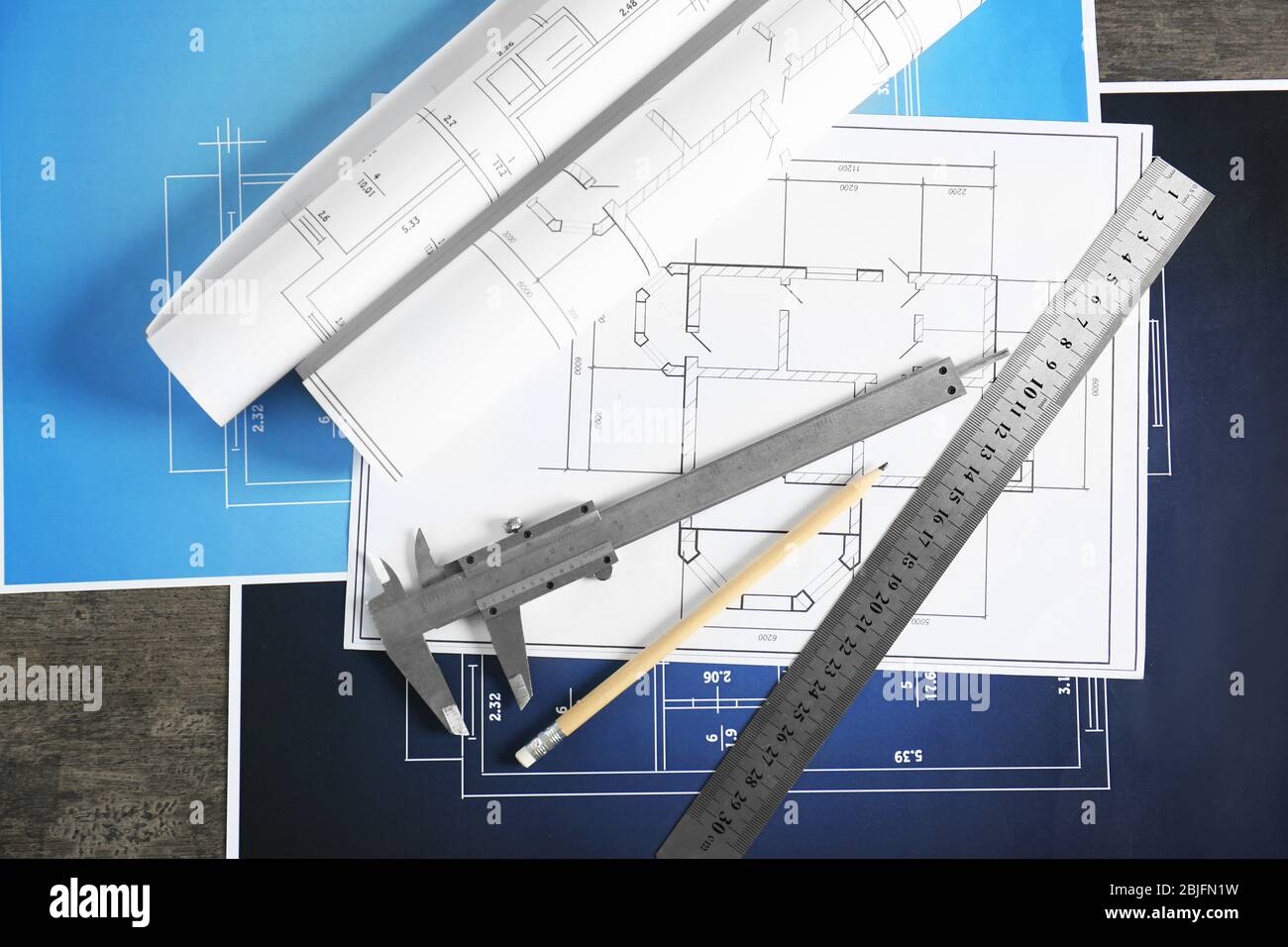 Calipers and pencil on engineering drawings Stock Photo - Alamy