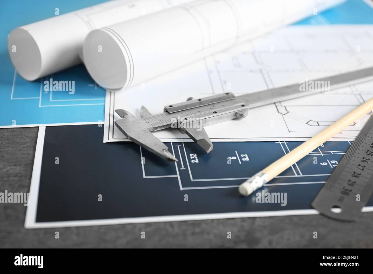 Calipers and pencil on engineering drawings Stock Photo - Alamy