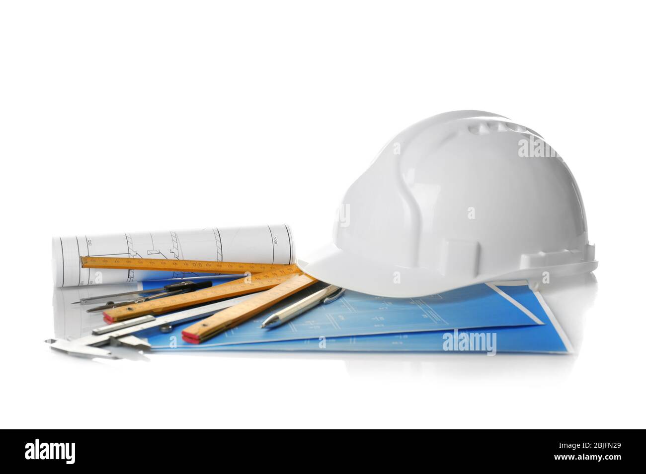 Blueprints, helmet and engineer supplies on white background Stock ...