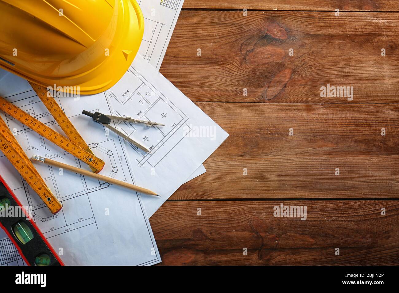 Blueprints and engineer equipment on table Stock Photo - Alamy