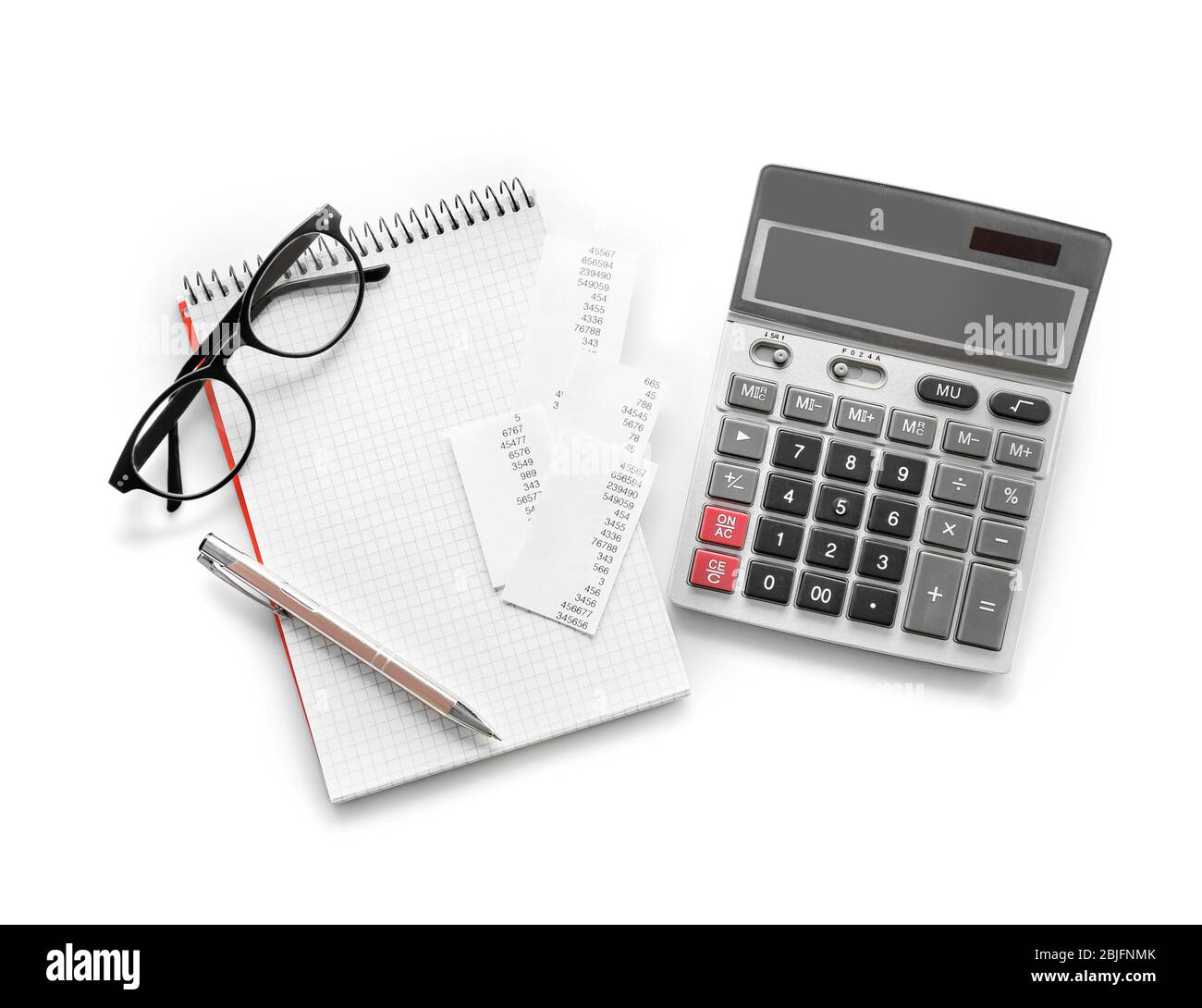 Gray calculator and notebook on white background Stock Photo - Alamy