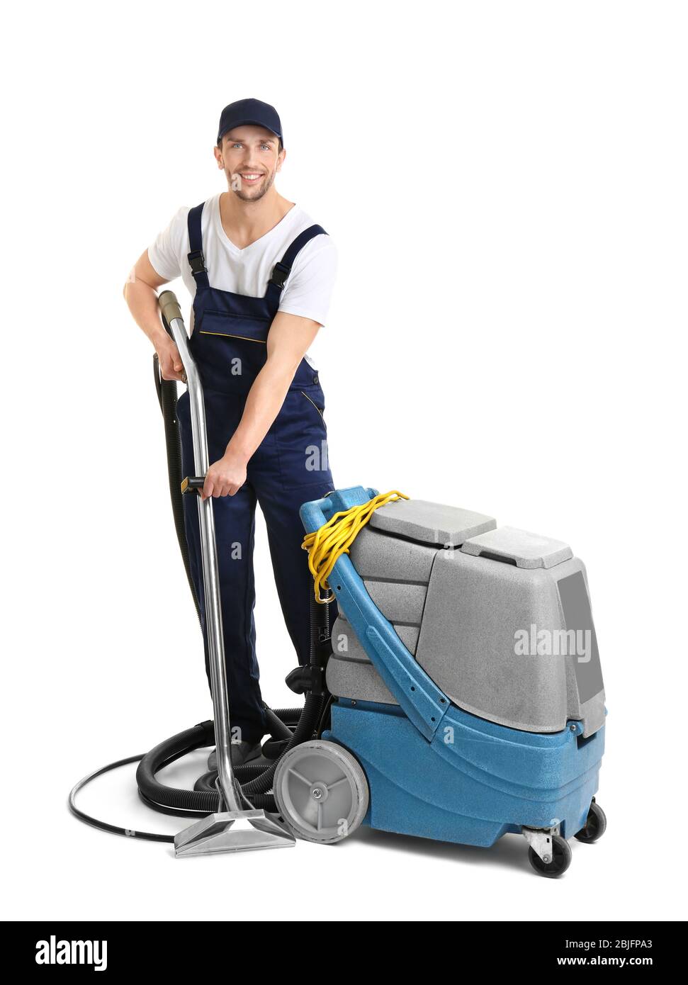 Dry cleaner's employee with special equipment on white background Stock ...