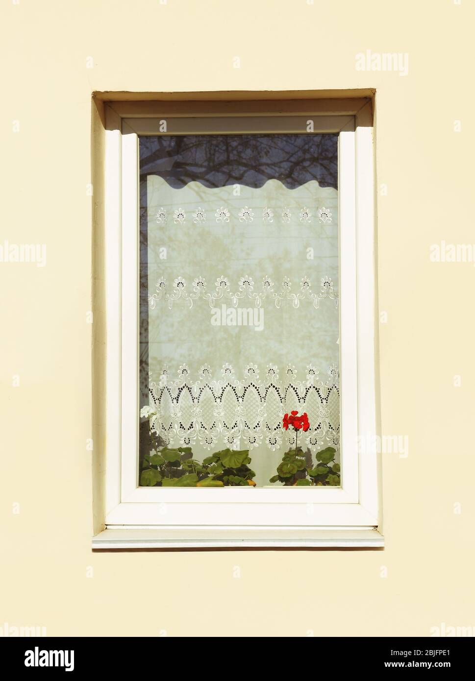 Decorated window on sand wall background Stock Photo - Alamy