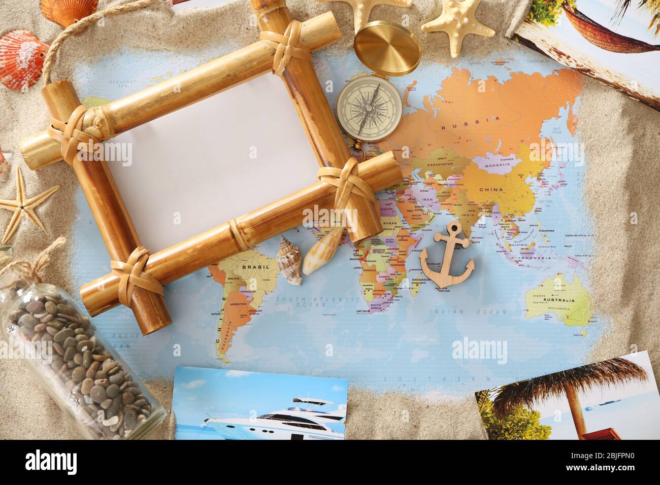 Travel concept. Composition with photo frame on world map background ...