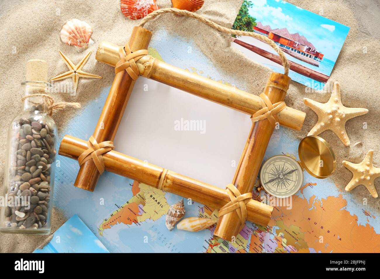 Travel concept. Composition with photo frame on world map background ...