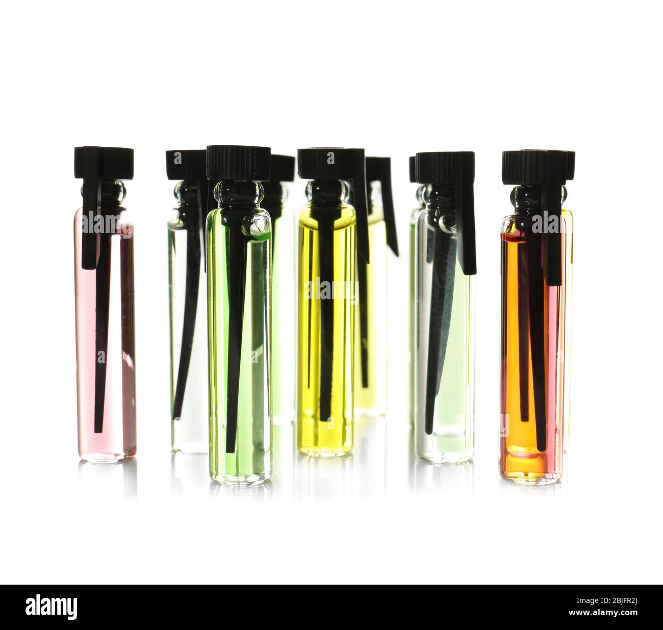 Perfume samples on white background Stock Photo - Alamy