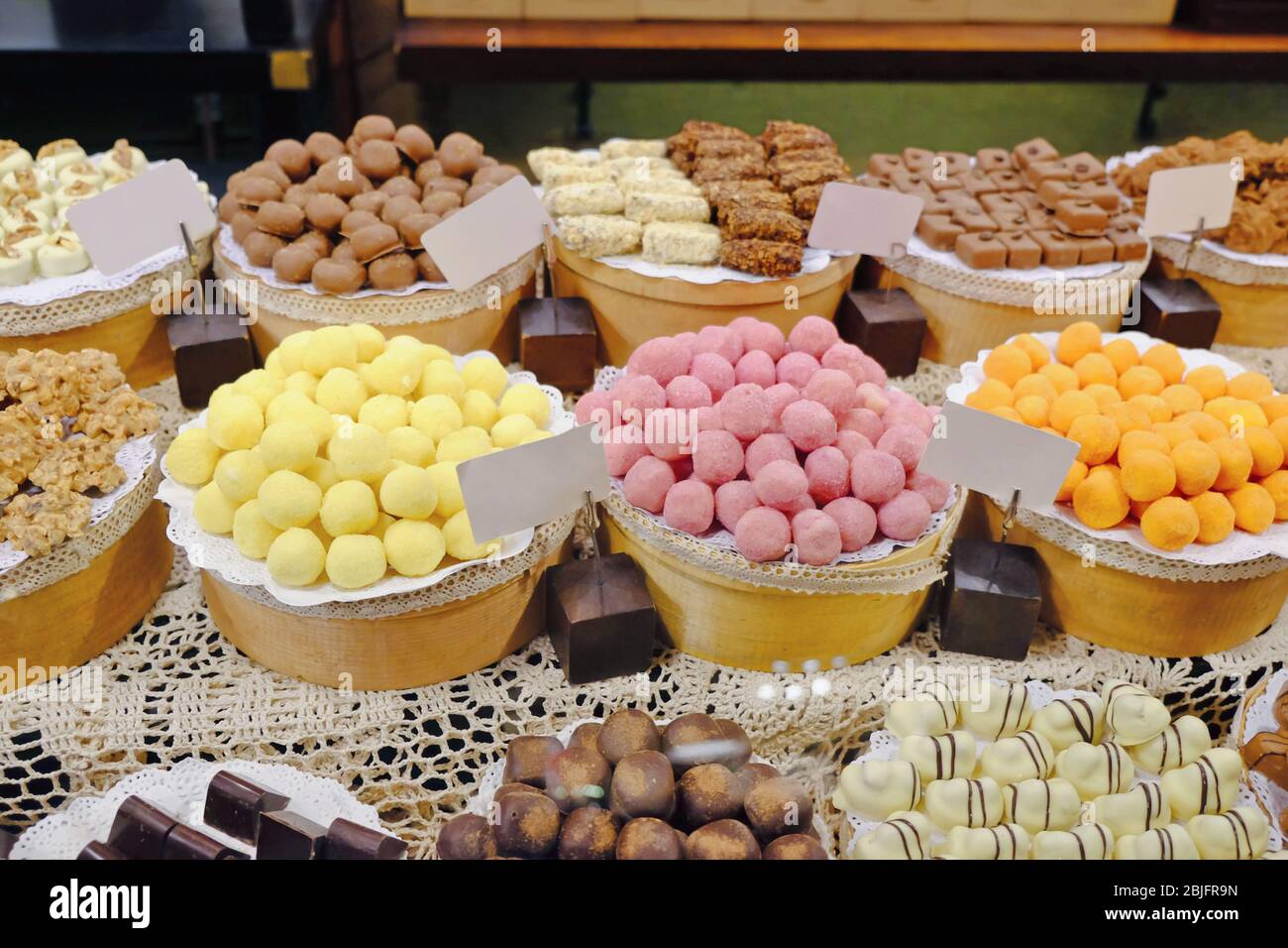 Various tasty sweets in candy shop Stock Photo - Alamy