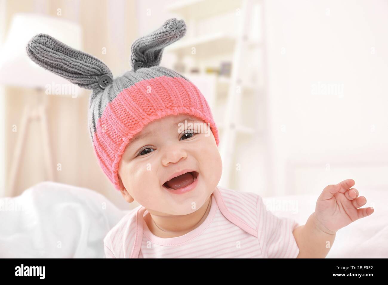 Cute little baby at home Stock Photo - Alamy
