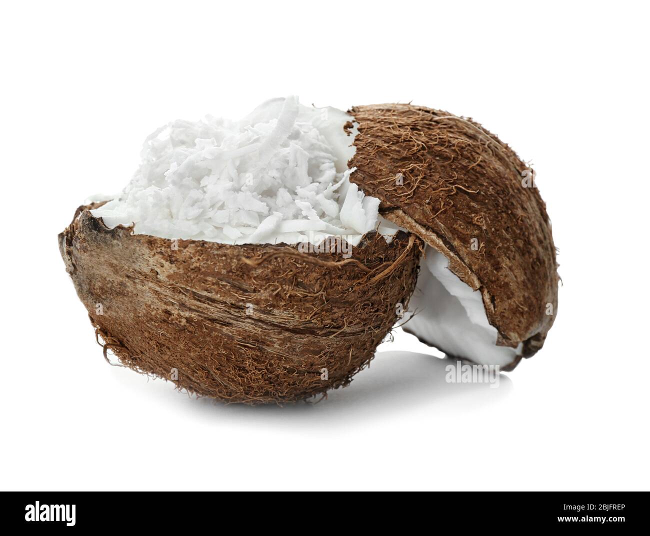 Coconut flakes and fresh nut on white background Stock Photo - Alamy
