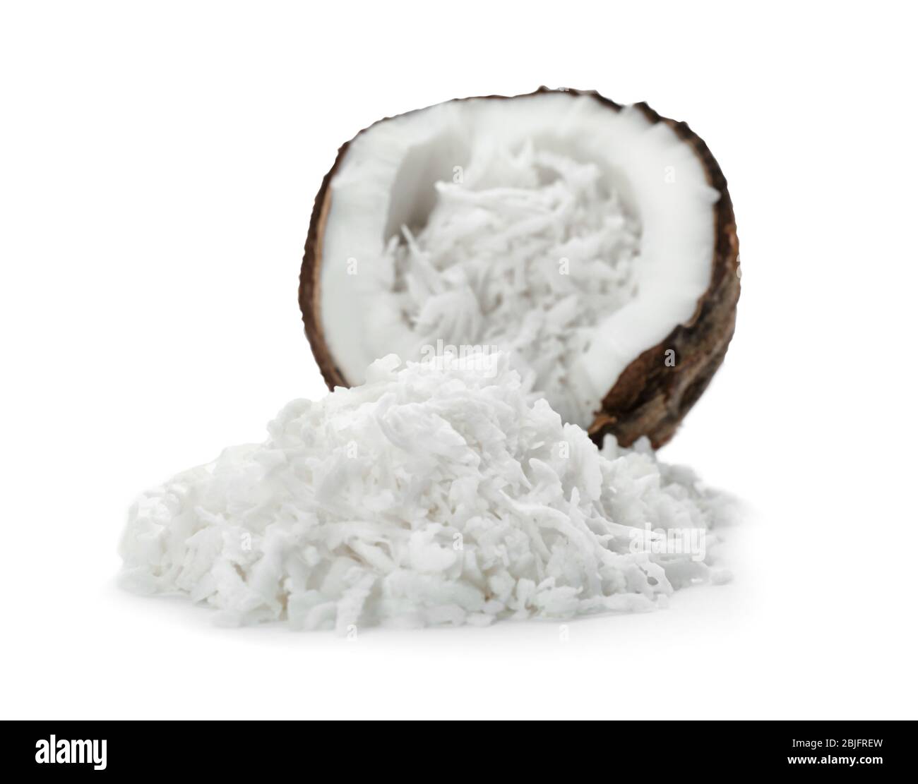 Heap of coconut flakes and fresh nut on white background Stock Photo ...