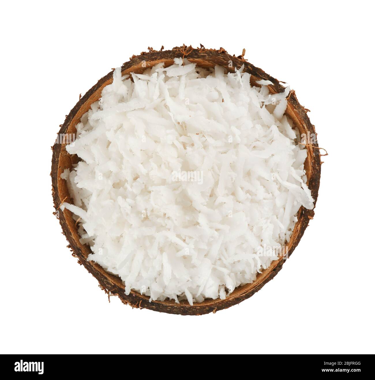 Grated coconut in shell on white background Stock Photo - Alamy
