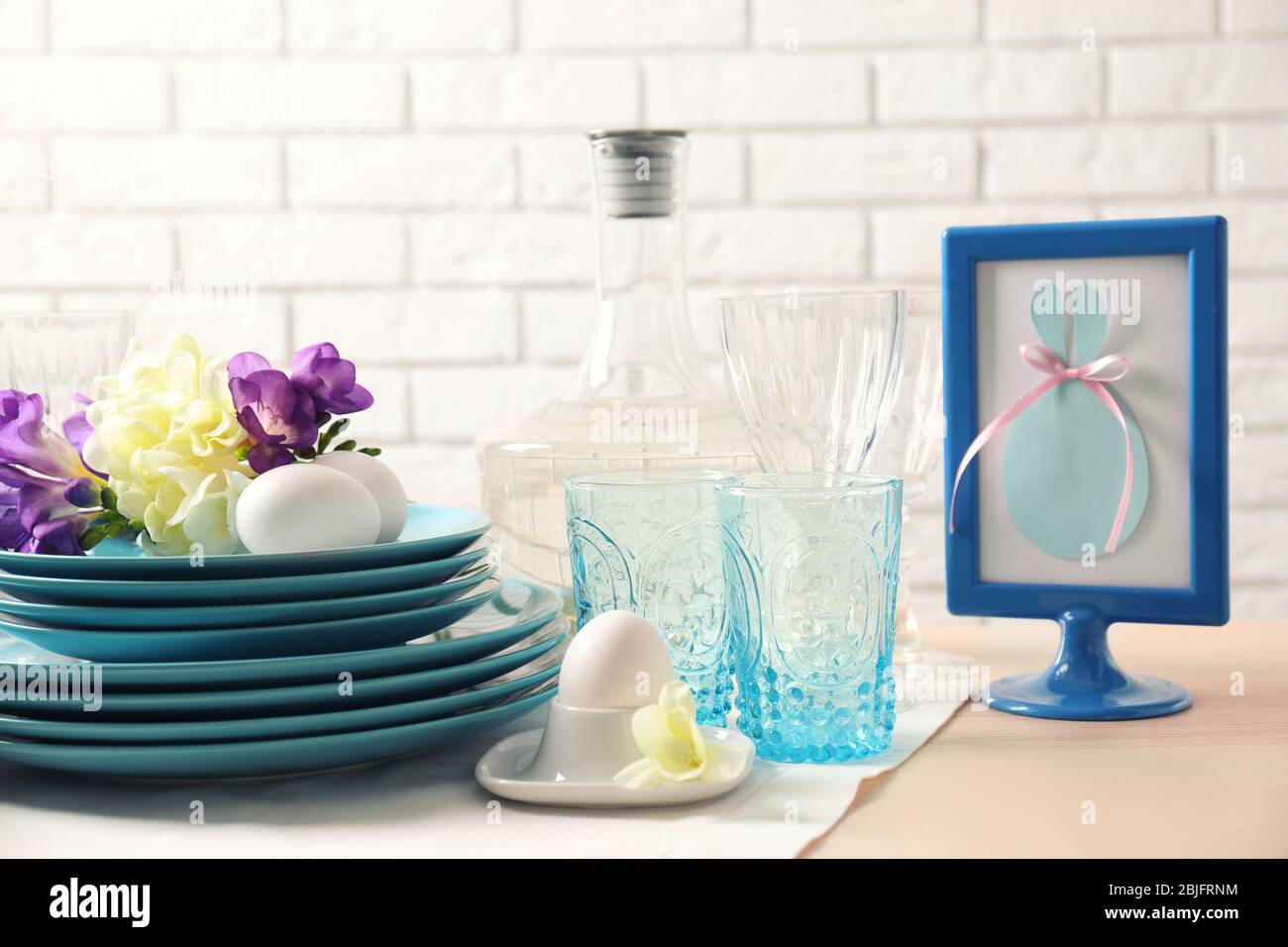Beautiful Easter table setting with blue plates Stock Photo - Alamy