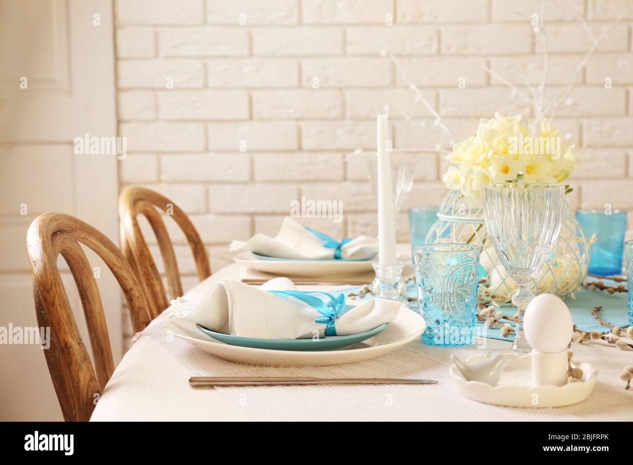 Beautiful Easter table setting with decorations Stock Photo - Alamy