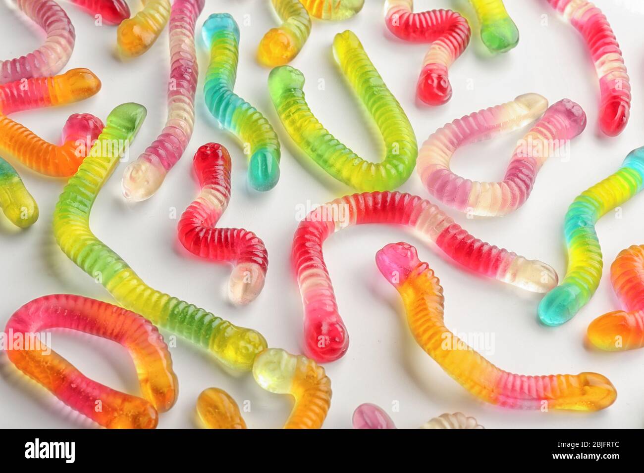 Tasty jelly worms on white background Stock Photo - Alamy