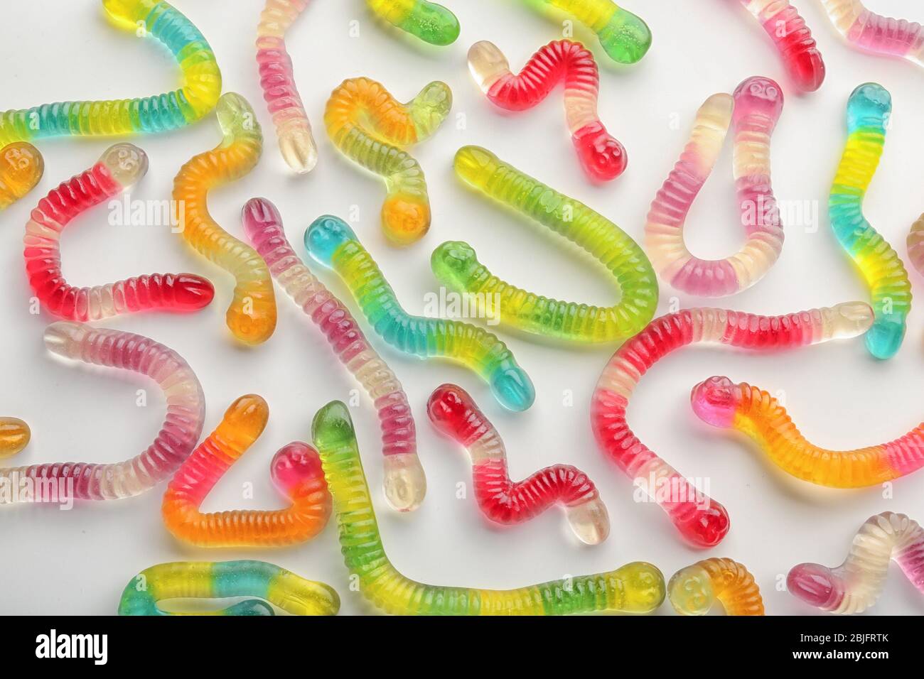Tasty jelly worms on white background Stock Photo - Alamy