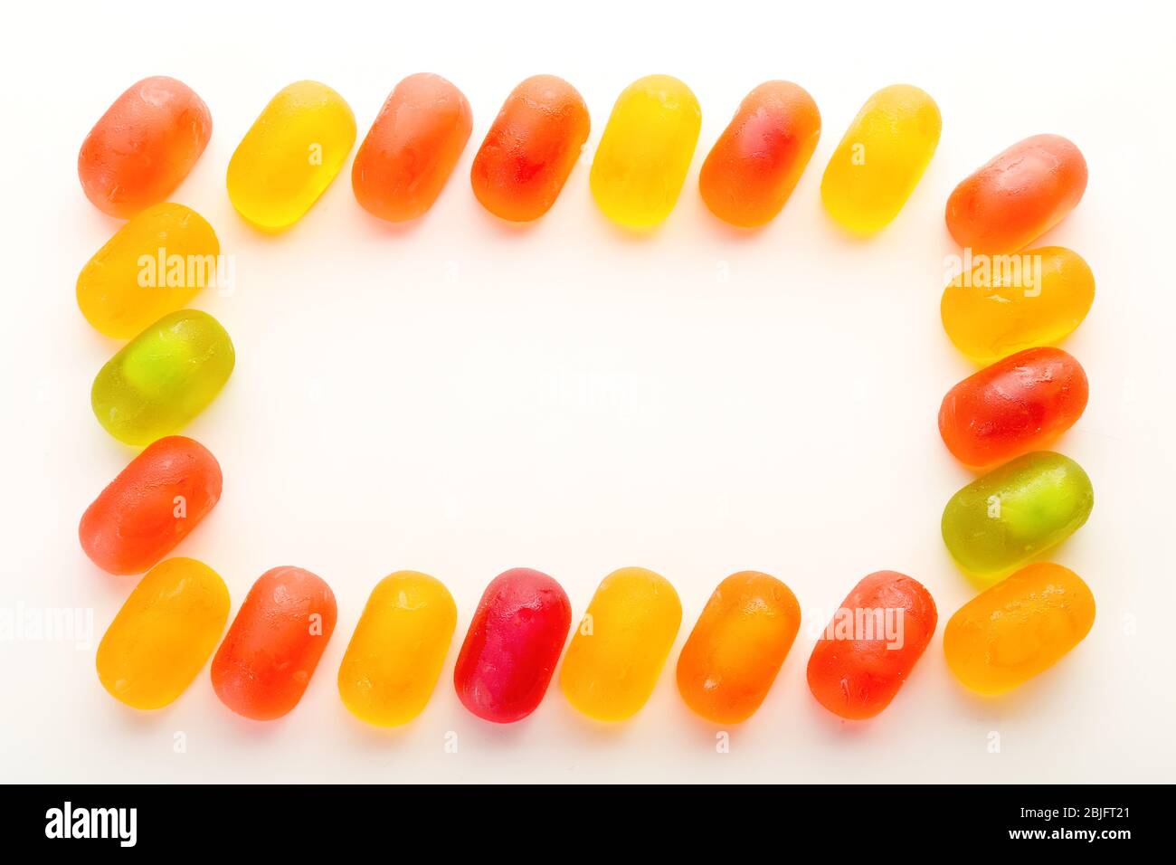 Frame made of tasty jelly candies on white background Stock Photo - Alamy